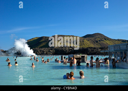 Tourists and visitors enjoy outdoor geothermal swimming pool at the ...