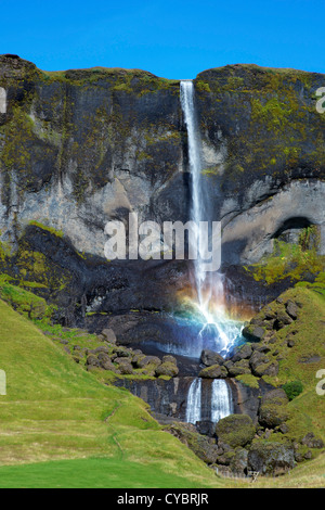 Waterfall in summer sunshine at Foss a Sidu, South coast, Iceland ...
