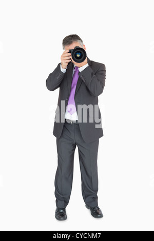 Business man using a camera Stock Photo - Alamy