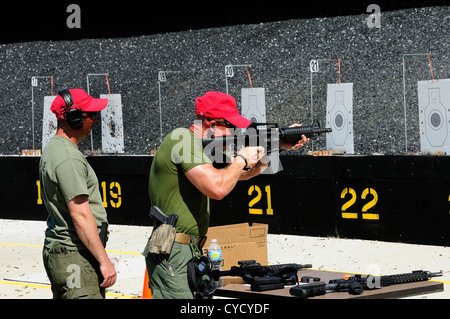 Gunman test firing automatic rifle at the FBI shooting range in Chicago ...