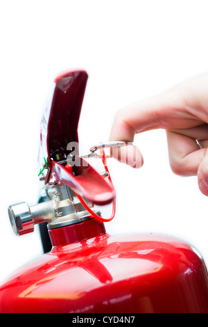 Hand pulling pin of fire extinguisher. Safety concept Stock Photo - Alamy