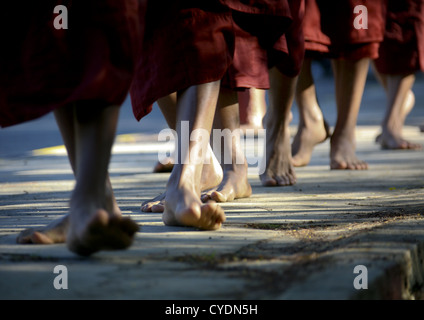 Monks at a small monastery in Bagan, Myanmar, begin a procession to an ...