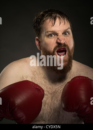 Heavyweight Boxer with red gloves and beard Stock Photo - Alamy