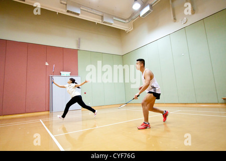 Asian friends playing badminton Stock Photo - Alamy
