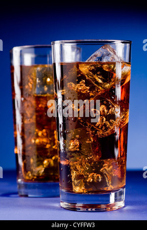 Photo of delicious cold glass with cola and ice cubes Stock Photo - Alamy
