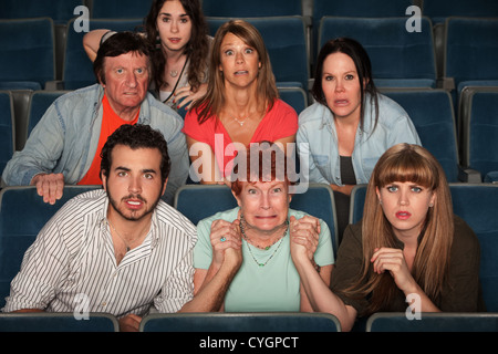 Group of seven scared people screaming in a theater Stock Photo - Alamy