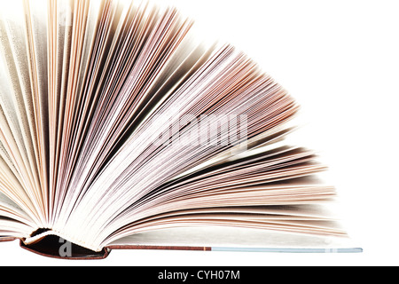 An open hardback reference book isolated on a pure white background ...