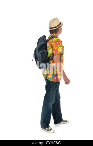 Handsome tourist with backpack and straw hat looking aside, smiling and ...