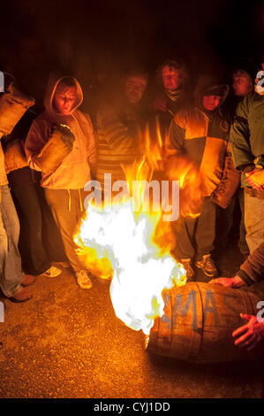 Rolling a tar barrel on Guy Fawkes night Stock Photo - Alamy