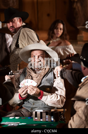 An old western cowboy is caught cheating at cards by the entire saloon ...