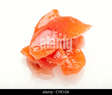 Candied segment of quince in jam Stock Photo - Alamy
