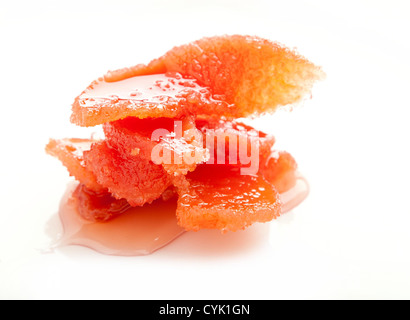Candied segment of quince in jam Stock Photo - Alamy