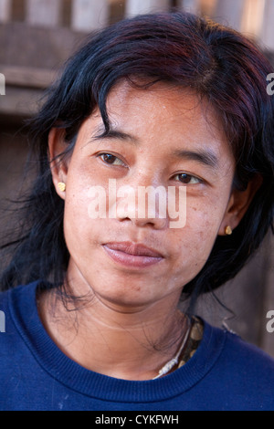 Myanmar, Burma. Woman of Intha Ethnic Group Rowing her Canoe, Inle Lake ...