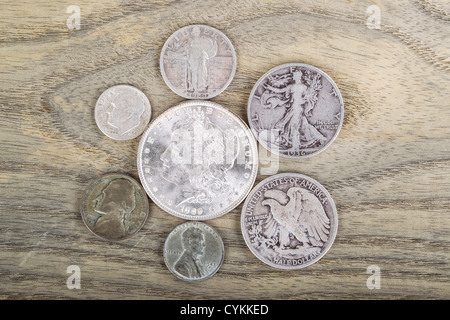Vintage silver coins on faded paper texture background Stock Photo - Alamy