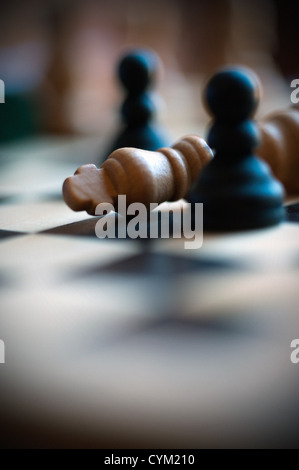 Black chess king lost to white. Black and white Stock Photo - Alamy