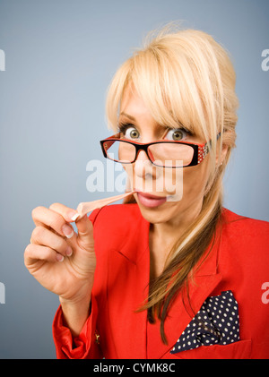 Portrait of businesswoman pulling chewing gum, smiling Stock Photo ...
