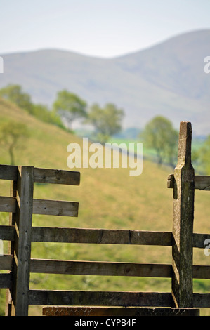 Fence and stile along country walk route Stock Photo - Alamy