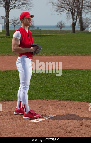 Pitcher Baseball Player with a red uniform on baseball Stadium Stock ...