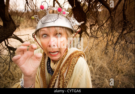Crazy woman wearing a metal colander for a helmet Stock Photo - Alamy