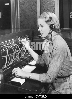 Telephone operator working at switchboard Stock Photo - Alamy