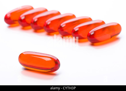 red tablets isolated on white background Stock Photo - Alamy