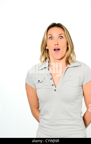 Young expressive blond woman in glasses surfing smartphone and looking ...