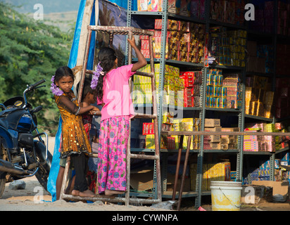 Indian children looking into a temporary Indian firework shop at Diwali ...