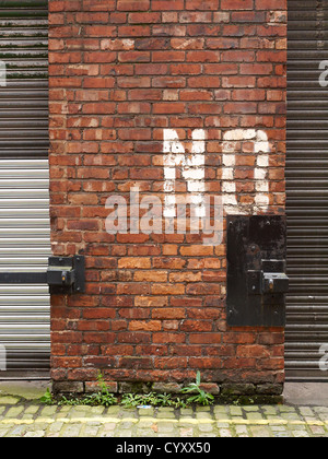 Writing on external brick wall Stock Photo - Alamy