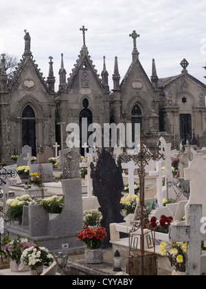 Graves and tombstones with crosses at the Christian Cemetery graveyard ...