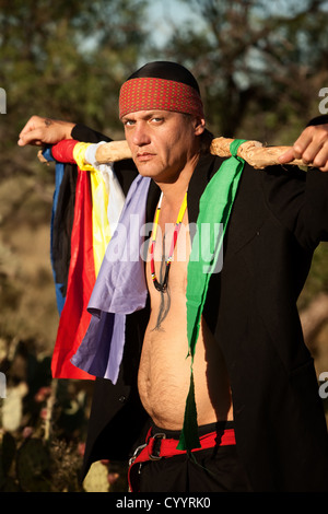 Native American man with colorful flags representing seven directions ...