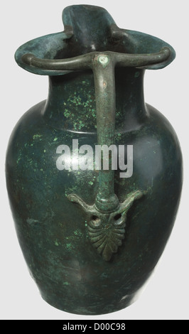 An Etruscan beak-spouted jug, 5th century BC. Bronze with fine, green ...