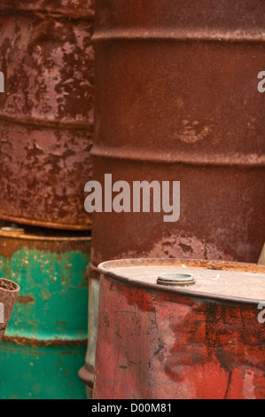 A stack of old rusty oil drums in a farmers field Stock Photo - Alamy
