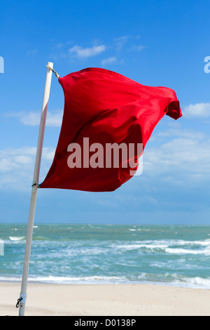 Red flag warning of dangerous currents at the sandy beach at West ...