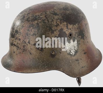 A model 1942 steel helmet,with three-colour sprayed-on "Sumpftarn ...