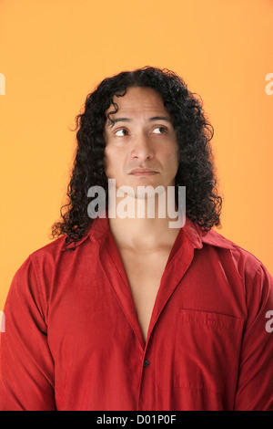 Handsome worried muscular Native American on an orange background Stock ...