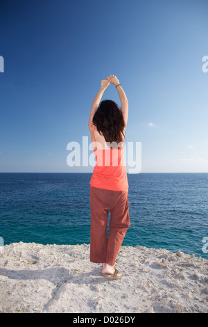 woman on red at Menorca island in Spain Stock Photo - Alamy