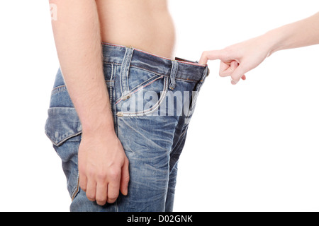 Girl looking in mens pants Stock Photo - Alamy