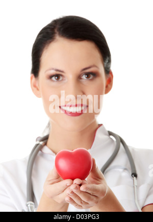 Young doctor with heart shape isolated on white Stock Photo - Alamy