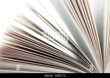 An open hardback reference book isolated on a pure white background ...