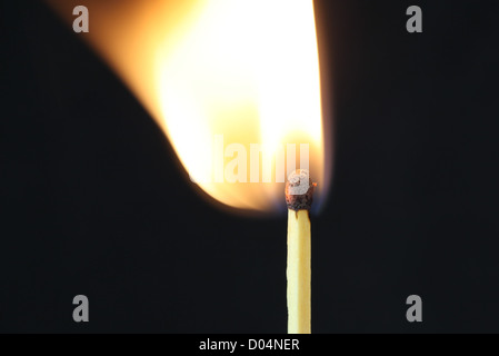 A match being struck, as a flame erupts from the tip Stock Photo - Alamy