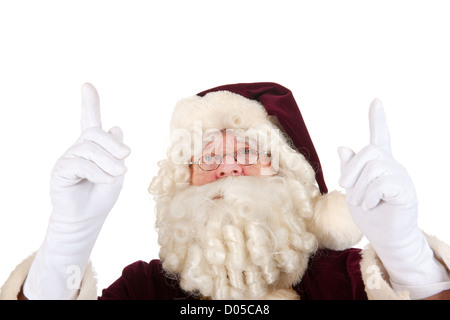Santa Claus is pointing upwards to something isolated over white ...