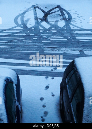 Car and foot tracks in the snow, snowy road Stock Photo - Alamy