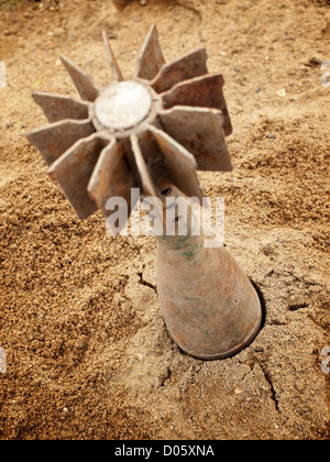 Old unexploded mortar shell grenade on the ground Stock Photo - Alamy