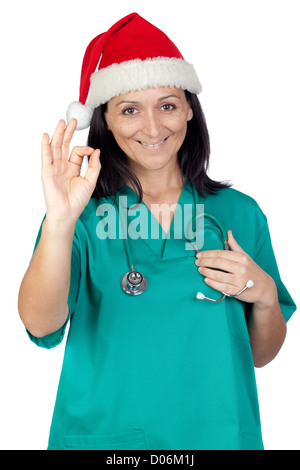 Attractive brunette doctor saying Ok isolated on a over white ...