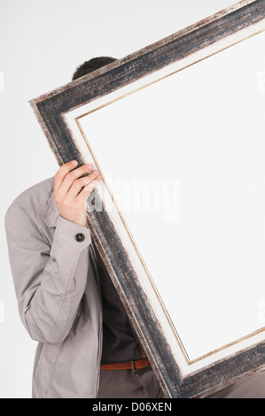 Hand holds empty rectangular wooden cutting kitchen board on white ...