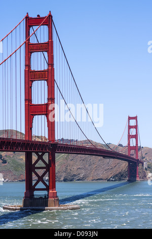 A vertical shot of the Golden Gate Bridge surrounded by clouds, San ...