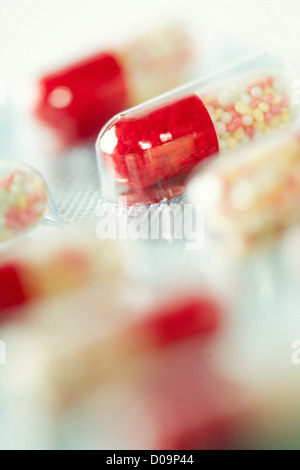 Red and transparent pill capsule Stock Photo - Alamy