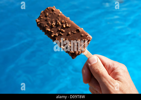 popsicle against a swimming pool on a hot day Stock Photo - Alamy