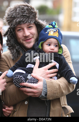 X Factor finalist Matt Cardle holding a baby outside at the studios ...