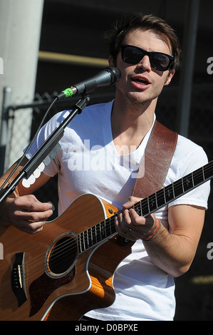 Kris Allen performs on the Landshark Tailgate stage prior to the Miami ...